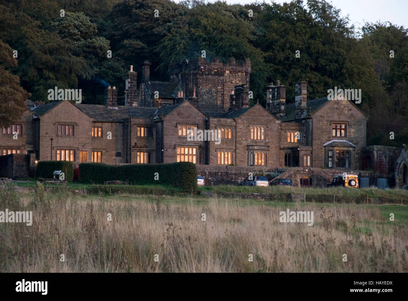 Evening sunlight lights up the windows of the Longshaw Lodge, Longshaw ...