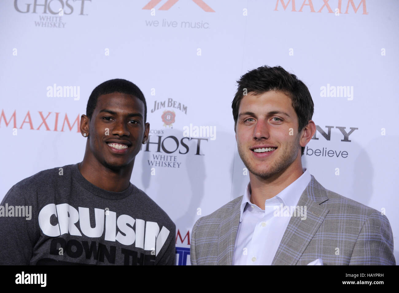 Football Players Justin Hunter and Tyler Eifert attend the Maxim 2013 ...