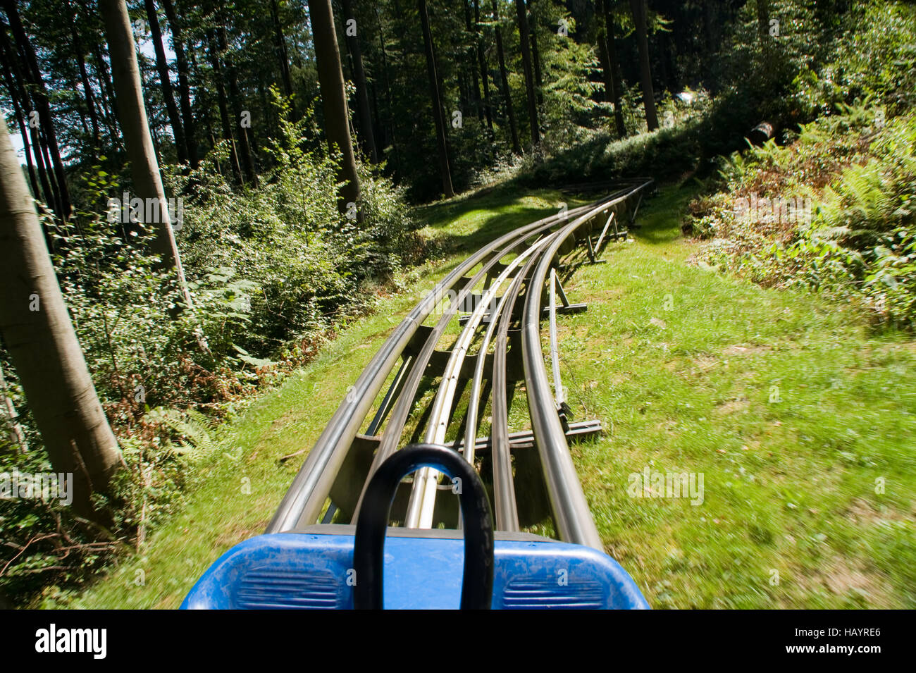 Curve of a summer toboggan run Stock Photo - Alamy