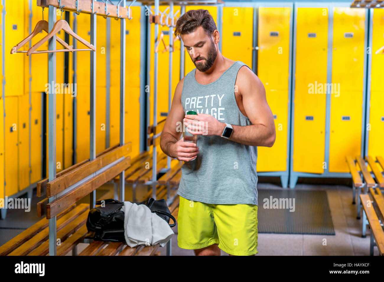 Sports man in the locker room Stock Photo - Alamy