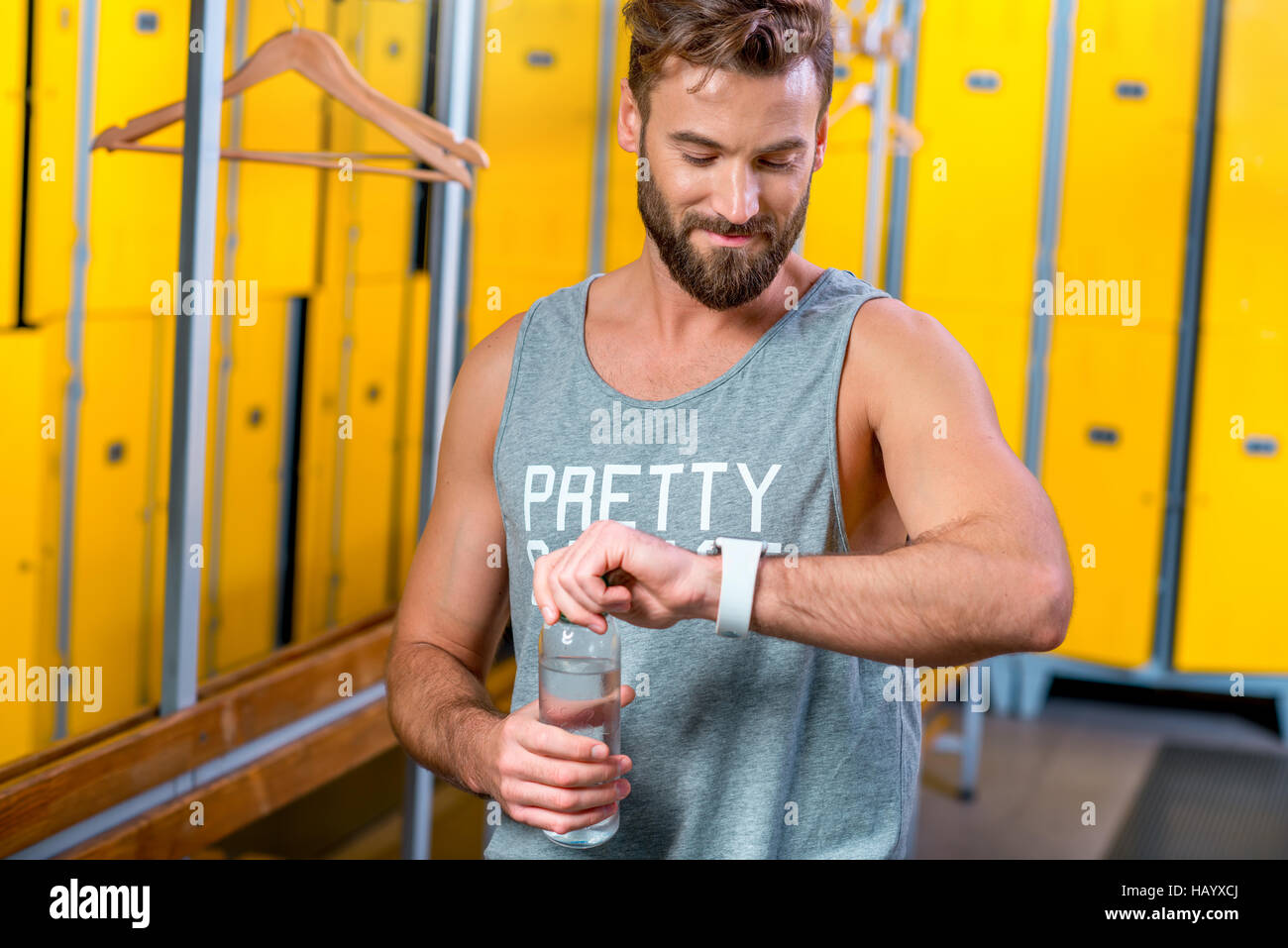 Sports man in the locker room Stock Photo - Alamy