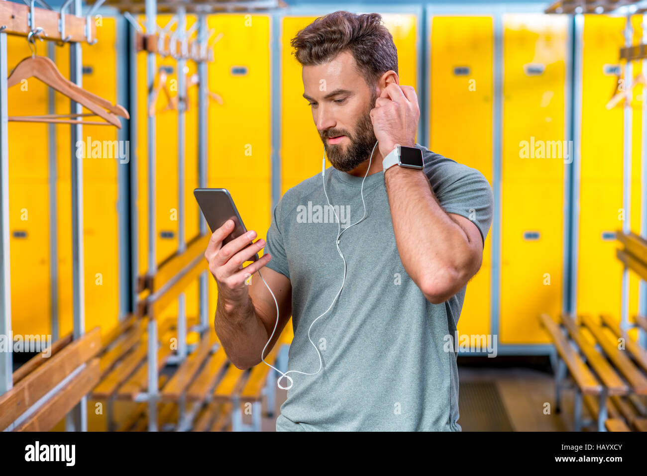 Sports man in the locker room Stock Photo - Alamy