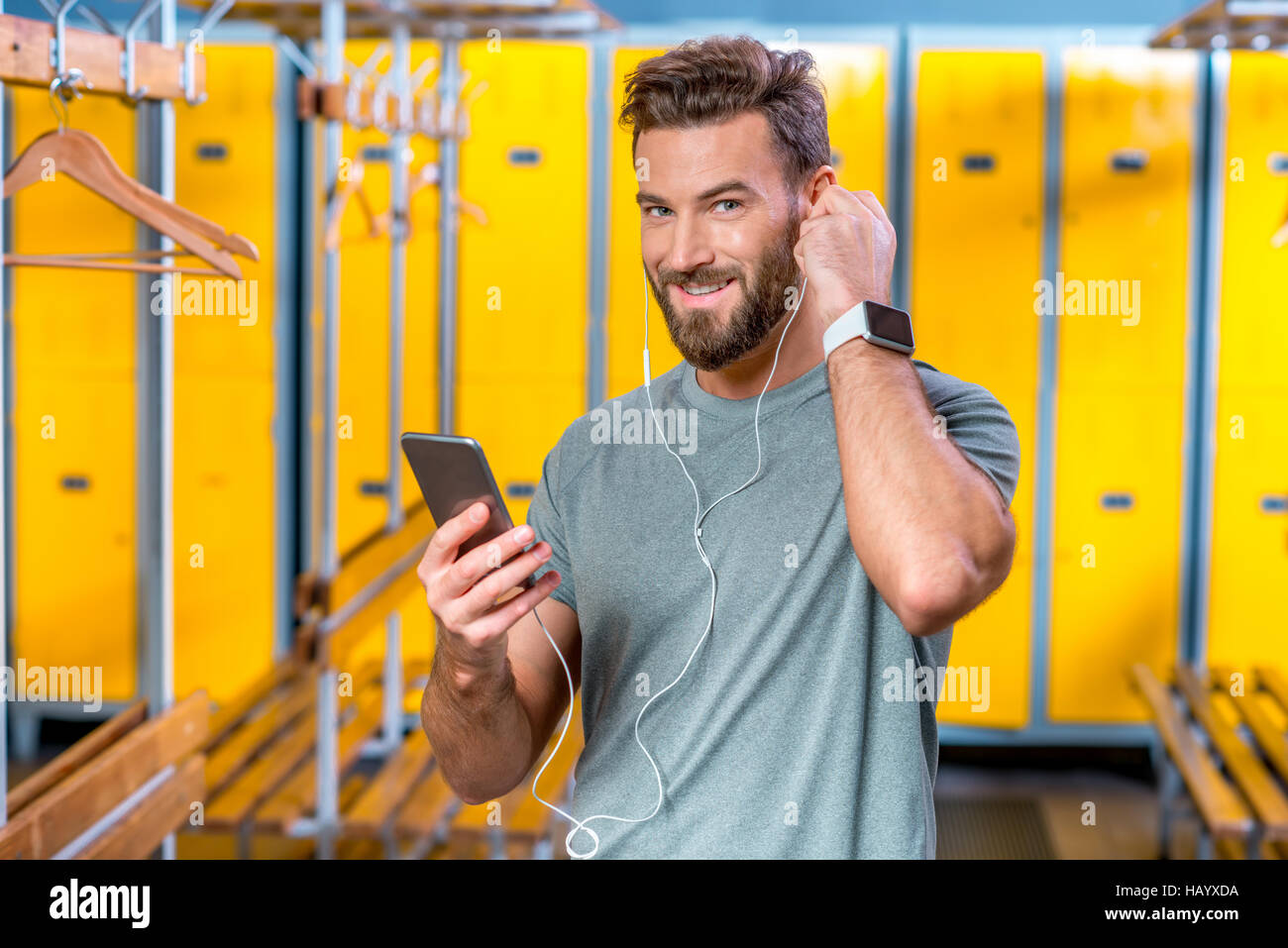 Sports man in the locker room Stock Photo - Alamy