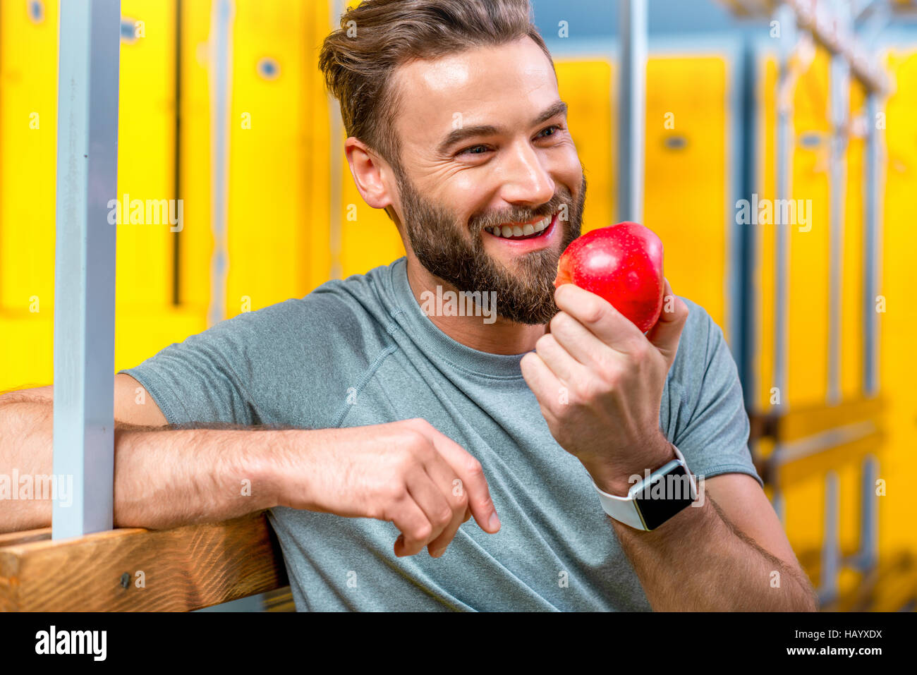 Man with apple in the gym Stock Photo - Alamy