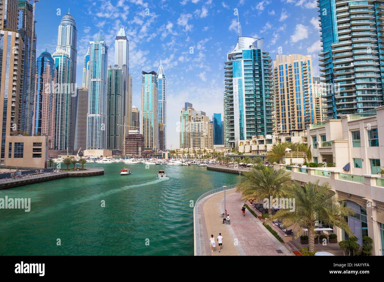 Promenade and canal in Dubai Marina with luxury skyscrapers around ...