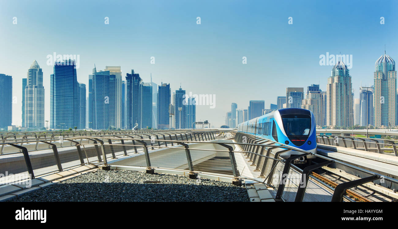 Metro railway and fully automated train in modern and luxury Dubai city ...