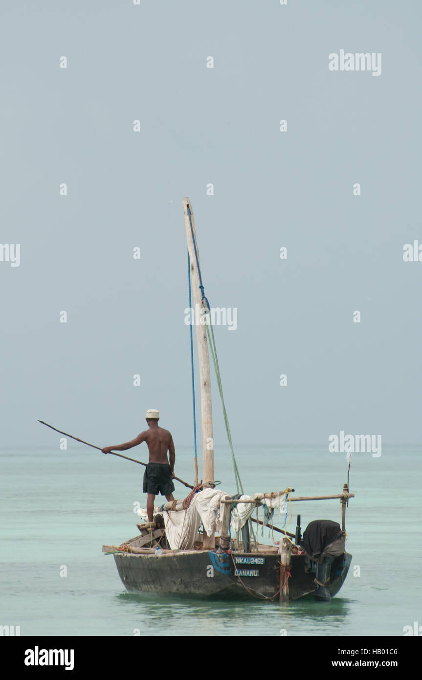 Man on Dhow Stock Photo - Alamy