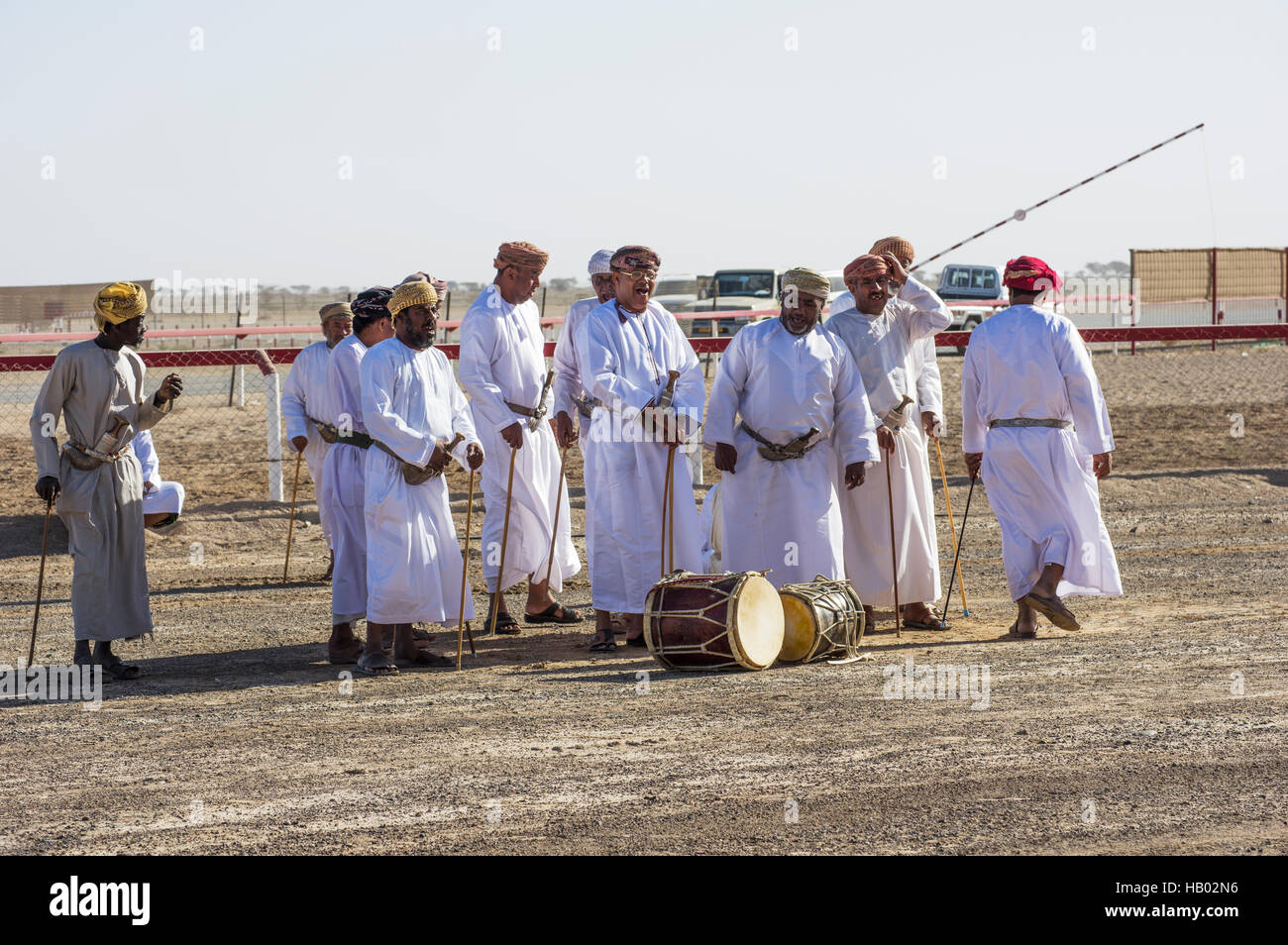 Musicians playing and singing traditional Omani music with instruments ...