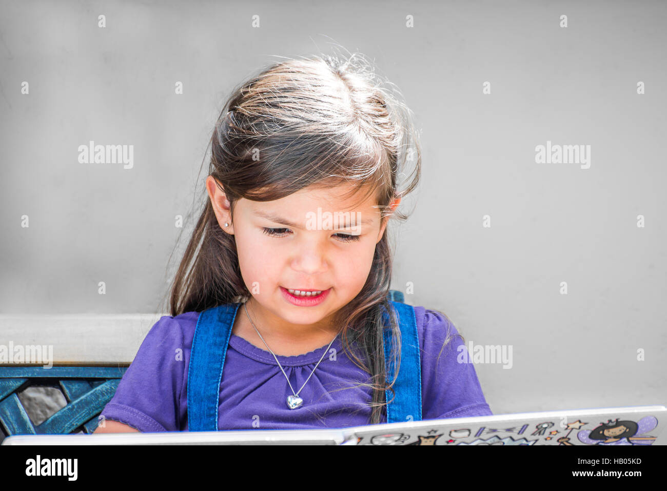Little Girl Reading Book Stock Photo - Alamy