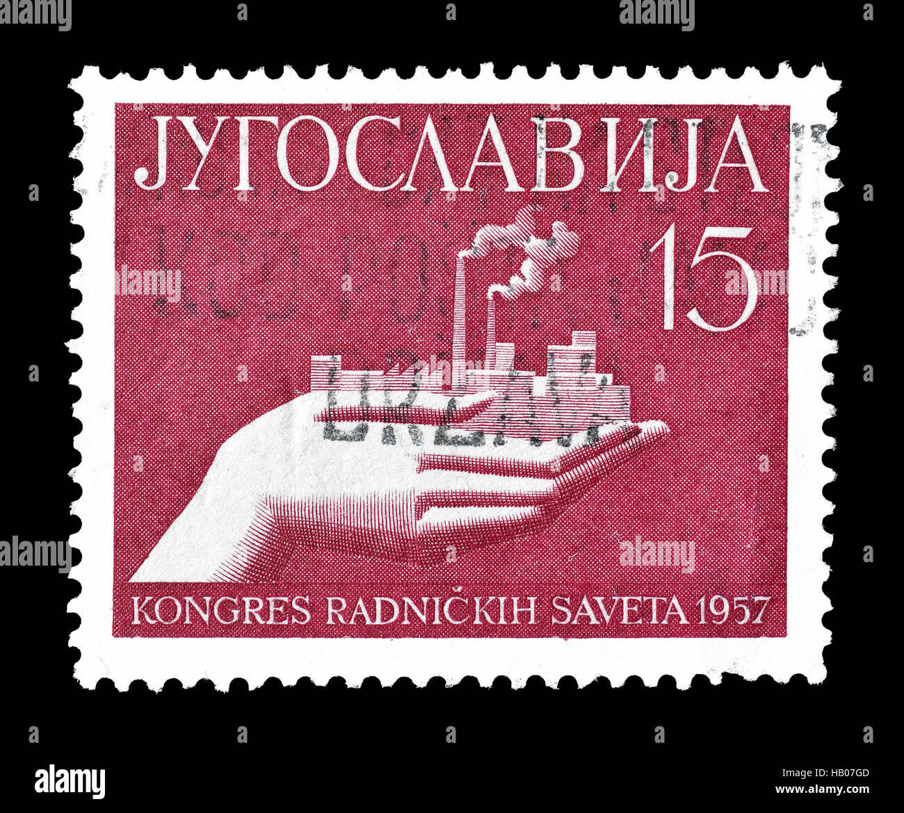 Cancelled postage stamp printed by Yugoslavia, that shows hand holding ...