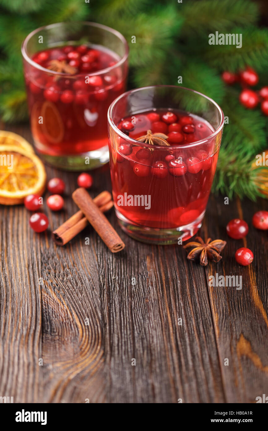 Christmas cranberry cocktail decorated with cinnamon sticks, anise ...