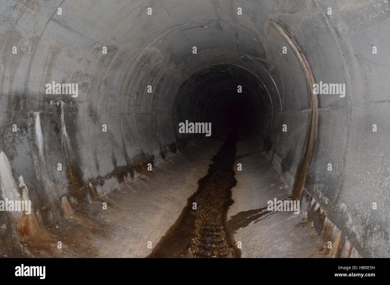 Urban exploration inside a tunnel Stock Photo - Alamy