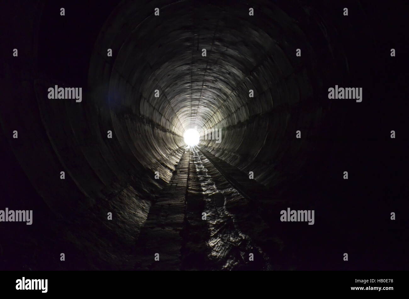 Urban exploration inside a tunnel Stock Photo - Alamy