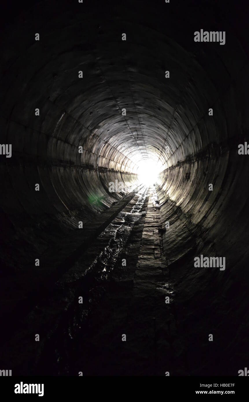 Urban exploration inside a tunnel Stock Photo - Alamy