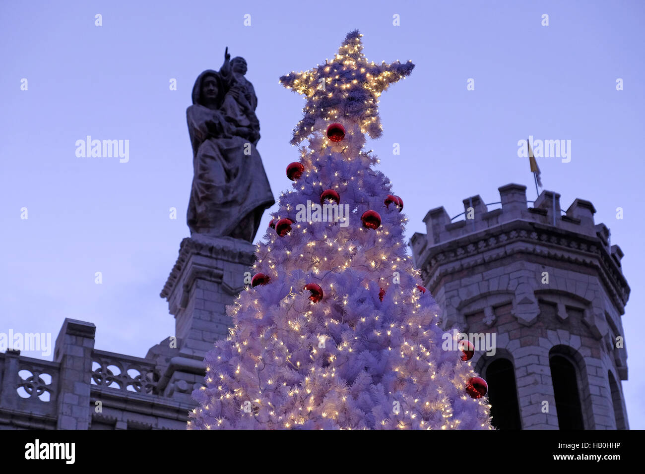 An illuminated Christmas tree displayed in front of the 19th century ...