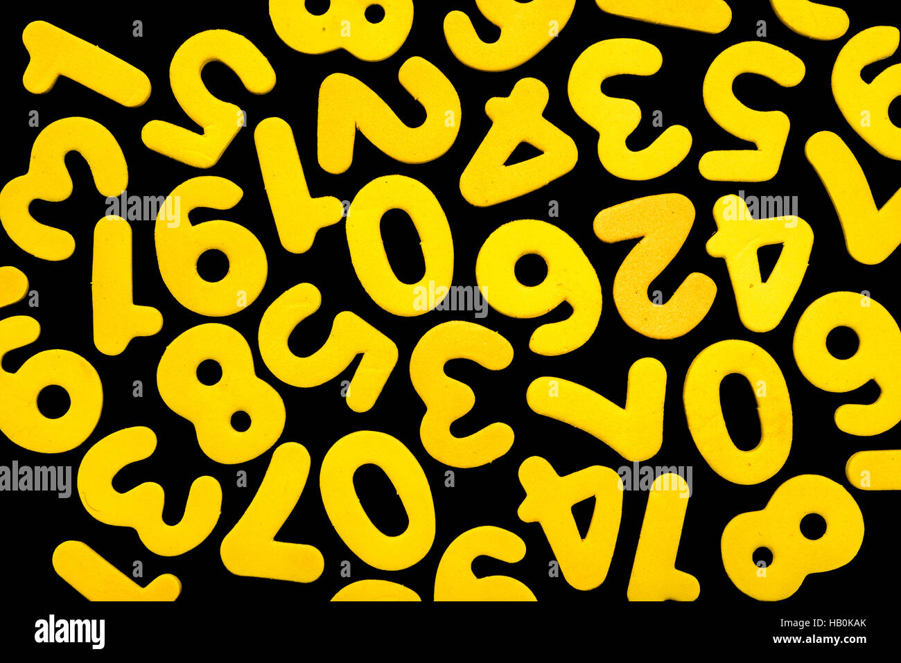 Mixed Yellow Numbes on Black Stock Photo - Alamy