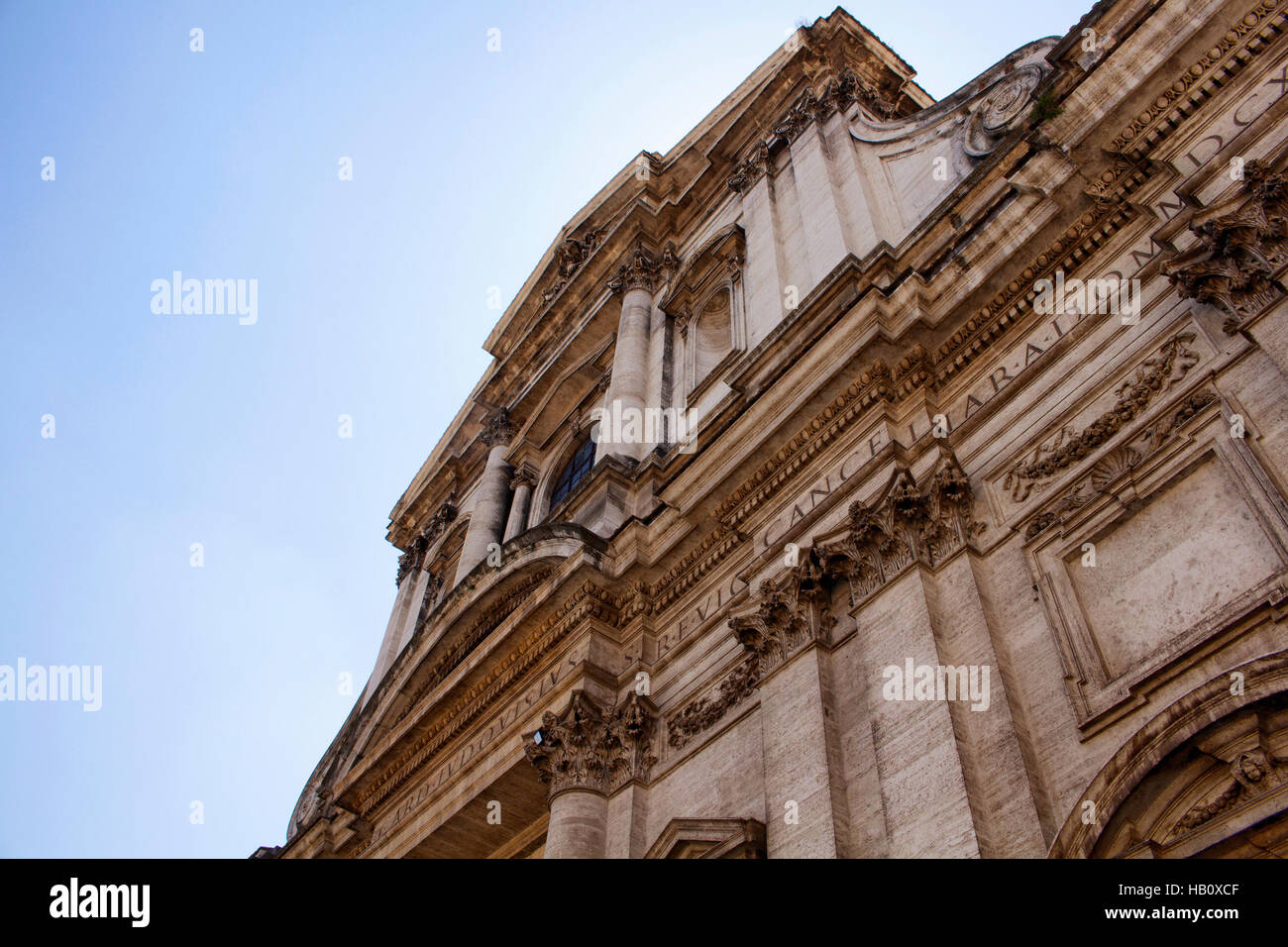Bottom view of a historical building in Rome with clear blue sky in the ...