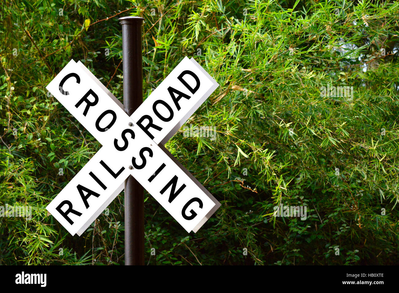 Railroad crossing with barrier or gate ahead Stock Photo - Alamy