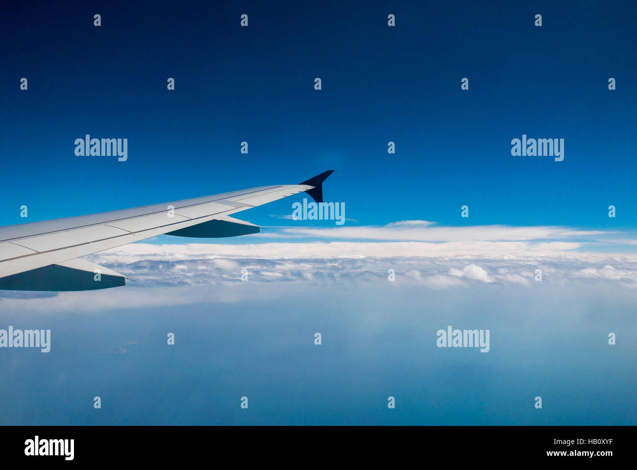 Plane flying above clouds over hi-res stock photography and images - Alamy