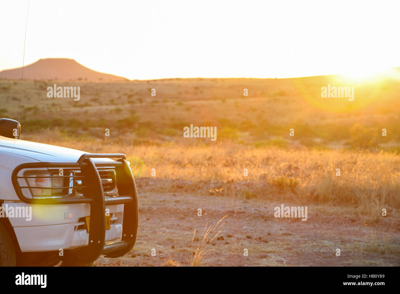 Bumper from 4x4 SUV with mountain and sunset in the background, Namibia ...