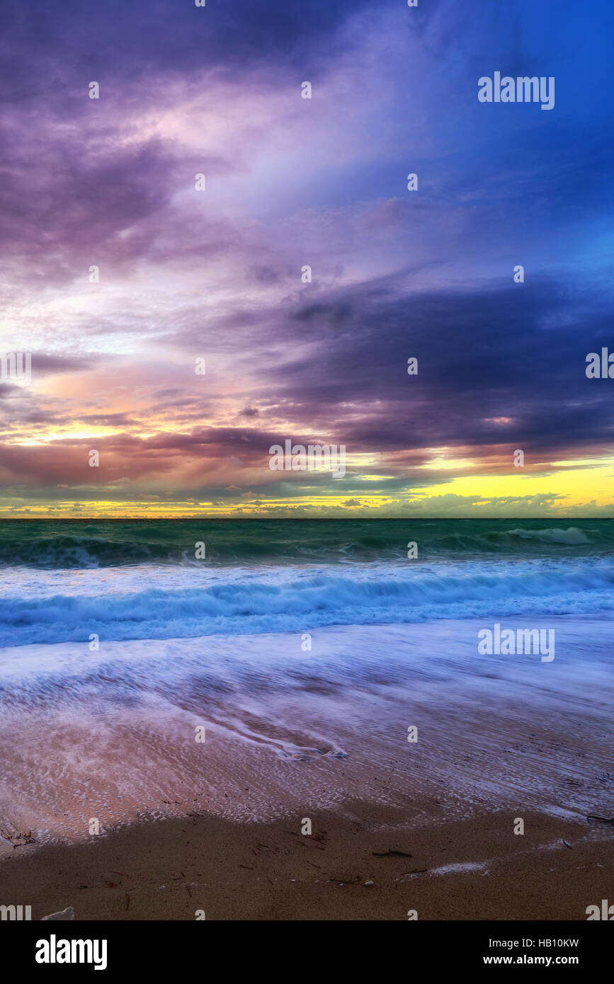 Sunset at the beach in Greece Stock Photo - Alamy
