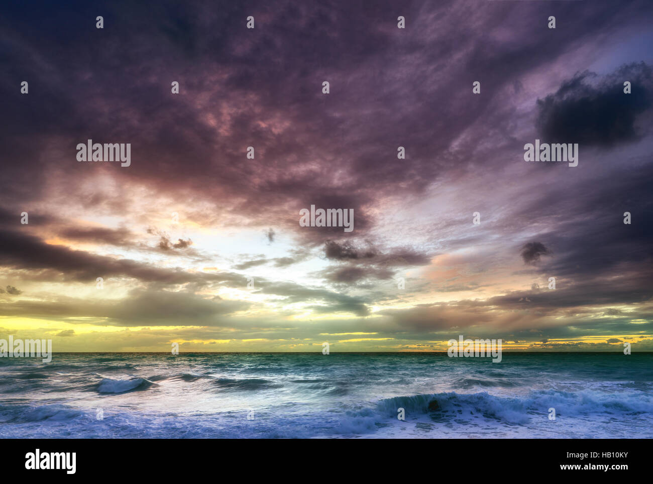 Sunset at the beach in Greece Stock Photo - Alamy