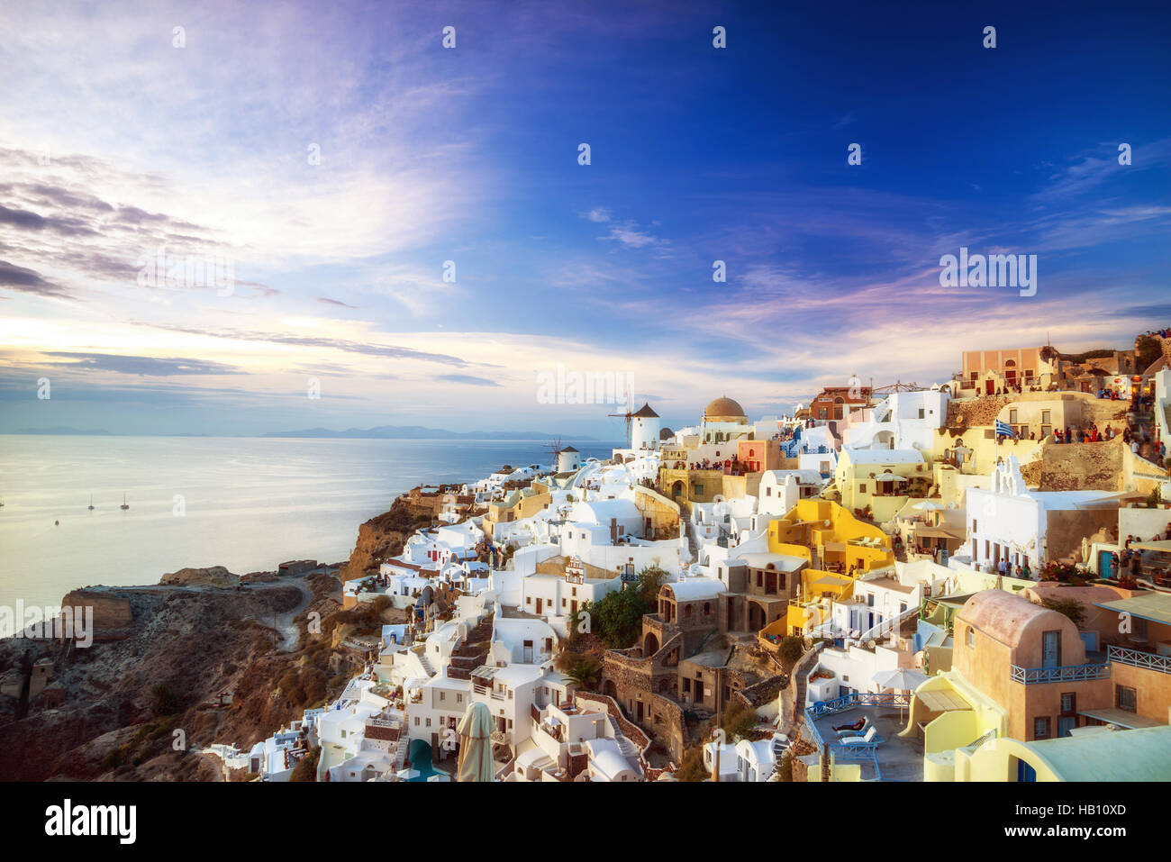 cityscape of Oia, traditional greek village of Santorini at sunset ...