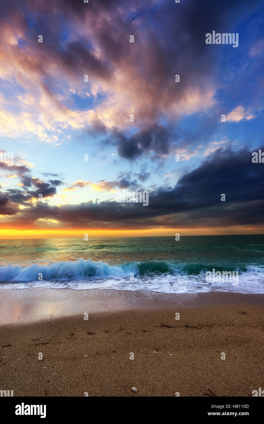 Sunset at the beach in Greece Stock Photo - Alamy