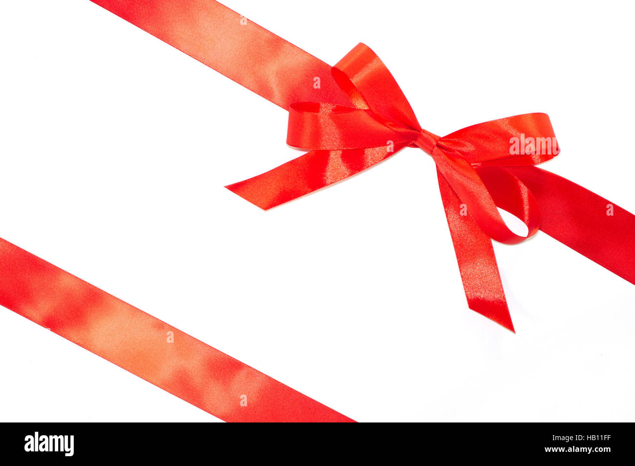 Red bow and diagonal ribbons with tails isolated on white background ...