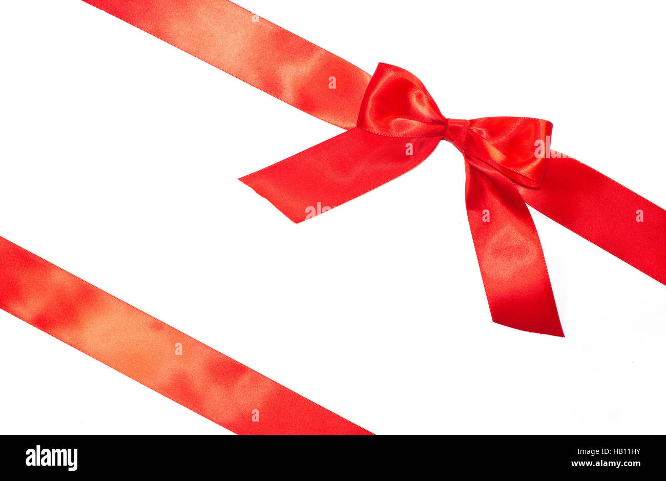 Red bow and diagonal ribbons with tails isolated on white background ...