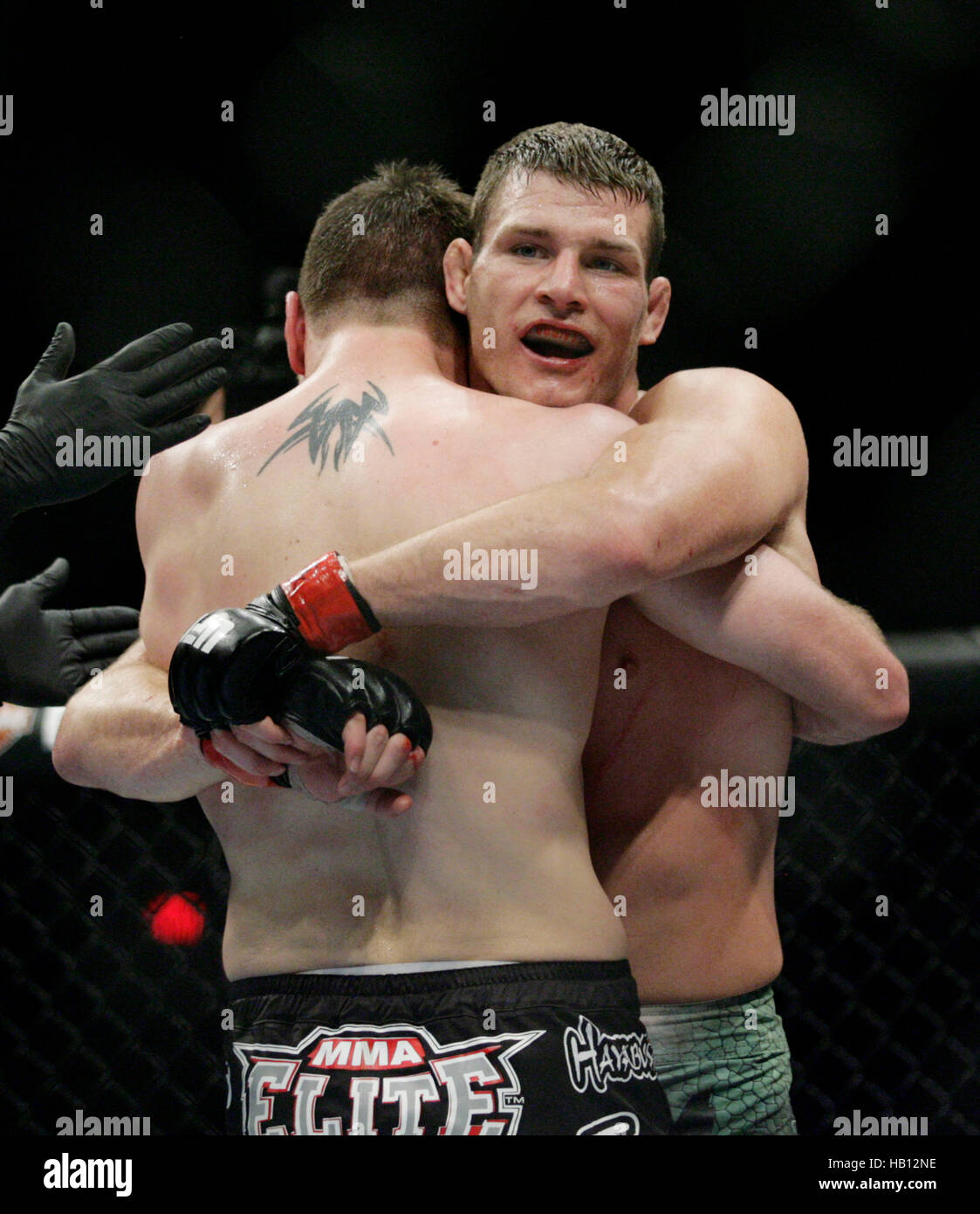 UFC fighter Michael Bisping, right, hugs Dan Miller after their match ...