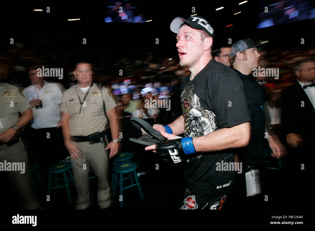 UFC fighter Dan Miller leaves the octagon after losing to Michael ...