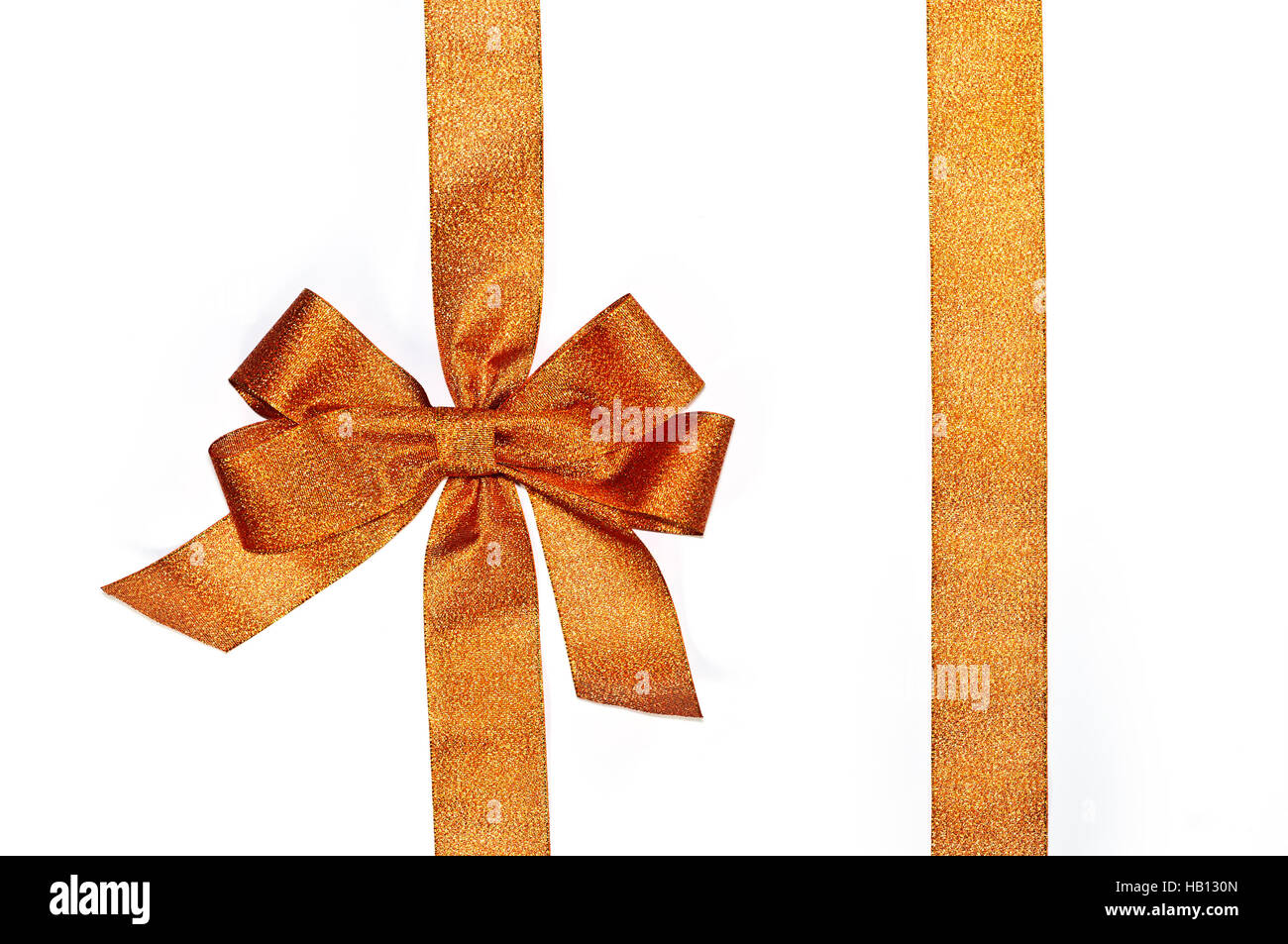 Golden vertical gift ribbons and luxurious bow isolated on white ...