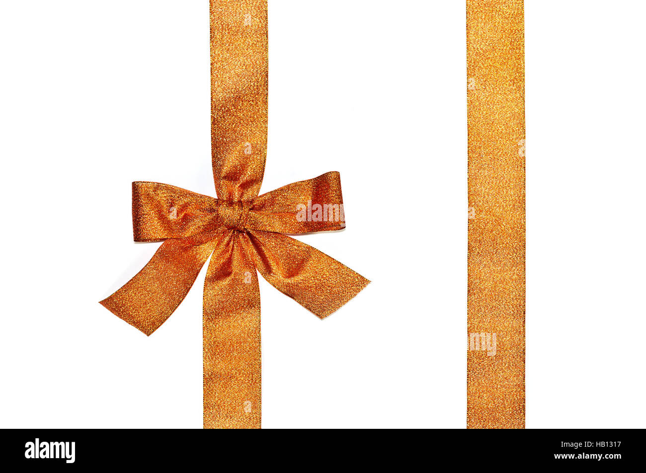 Golden vertical gift ribbons and luxurious bow isolated on white ...