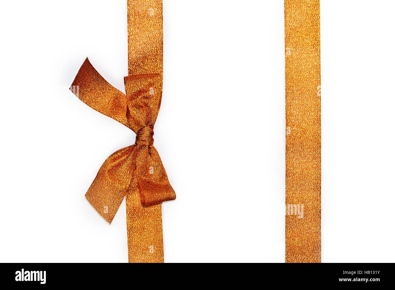 Golden vertical gift ribbons and luxurious bow isolated on white ...