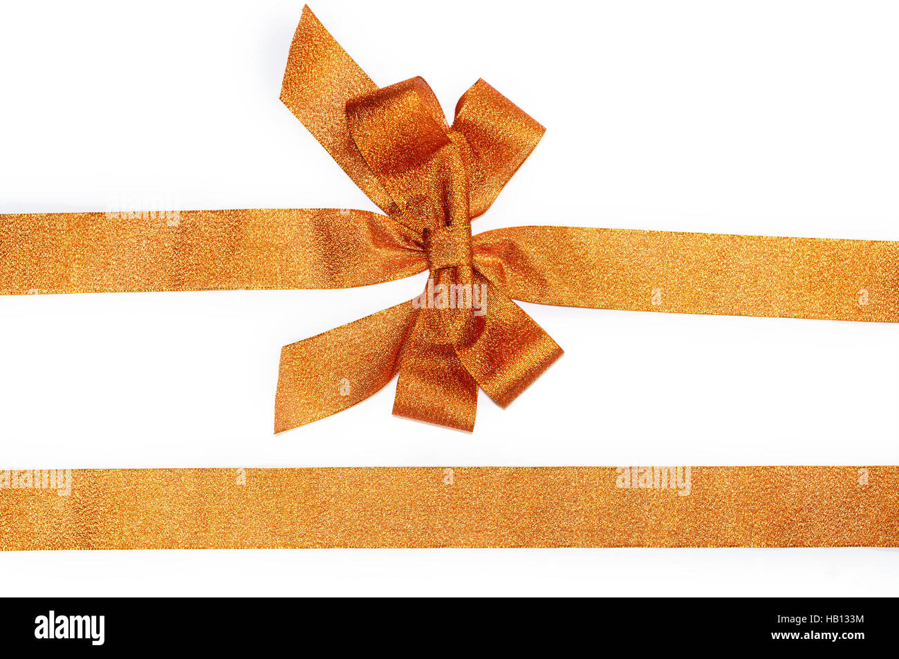 Golden horizontal gift ribbons and luxurious bow isolated on white ...
