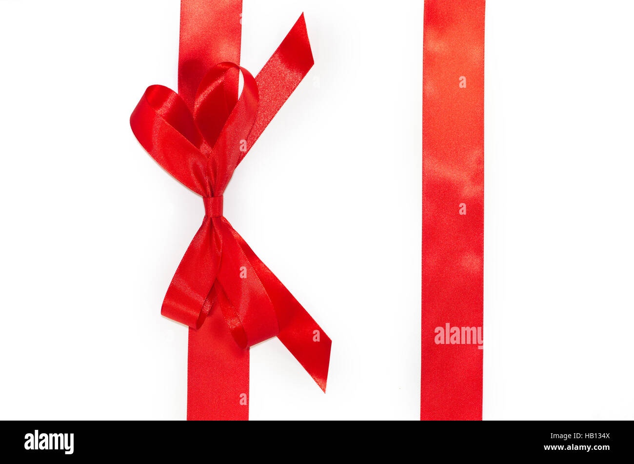Red vertical gift ribbons and luxurious bow isolated on white ...