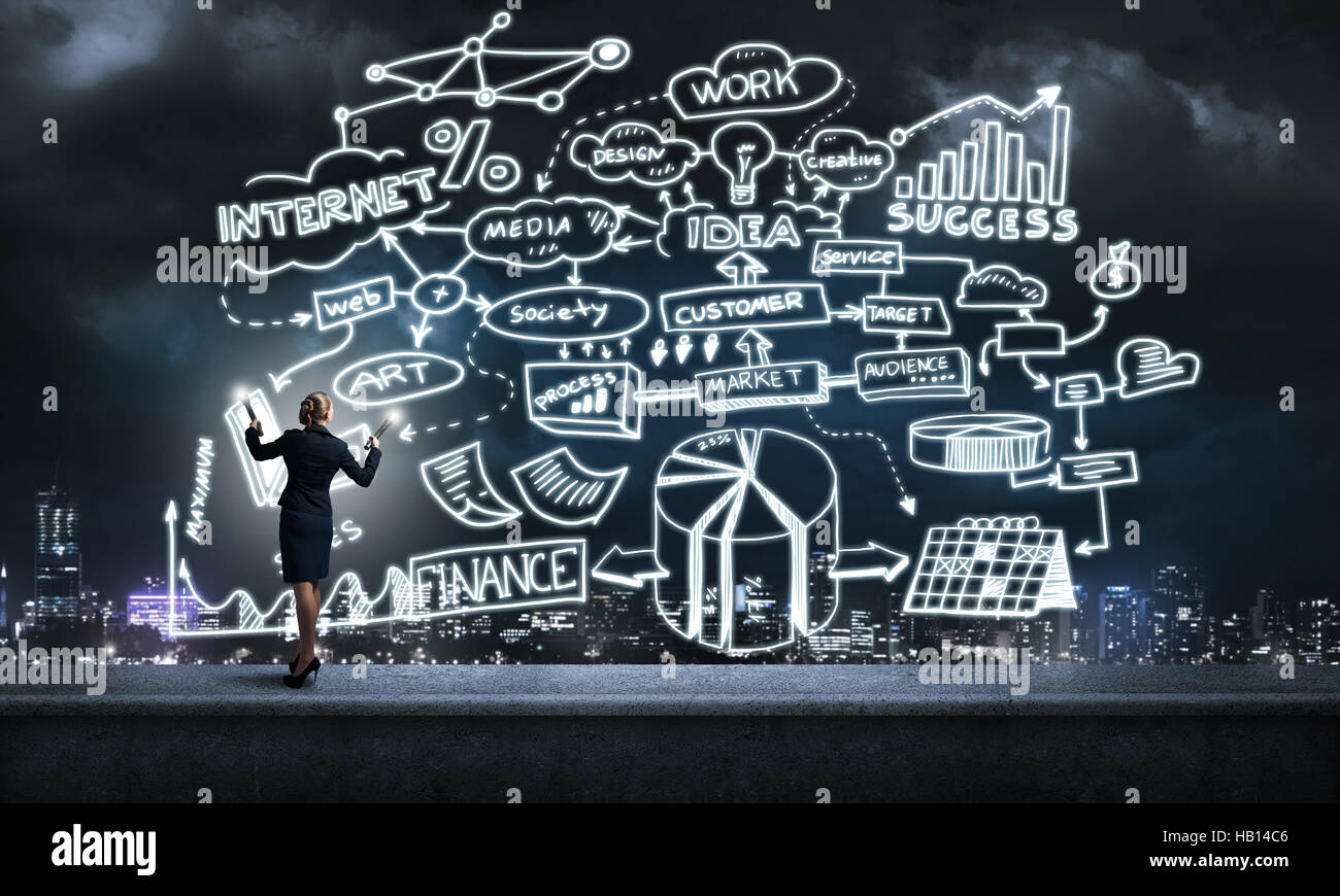 Woman throwing light on her ideas Stock Photo - Alamy