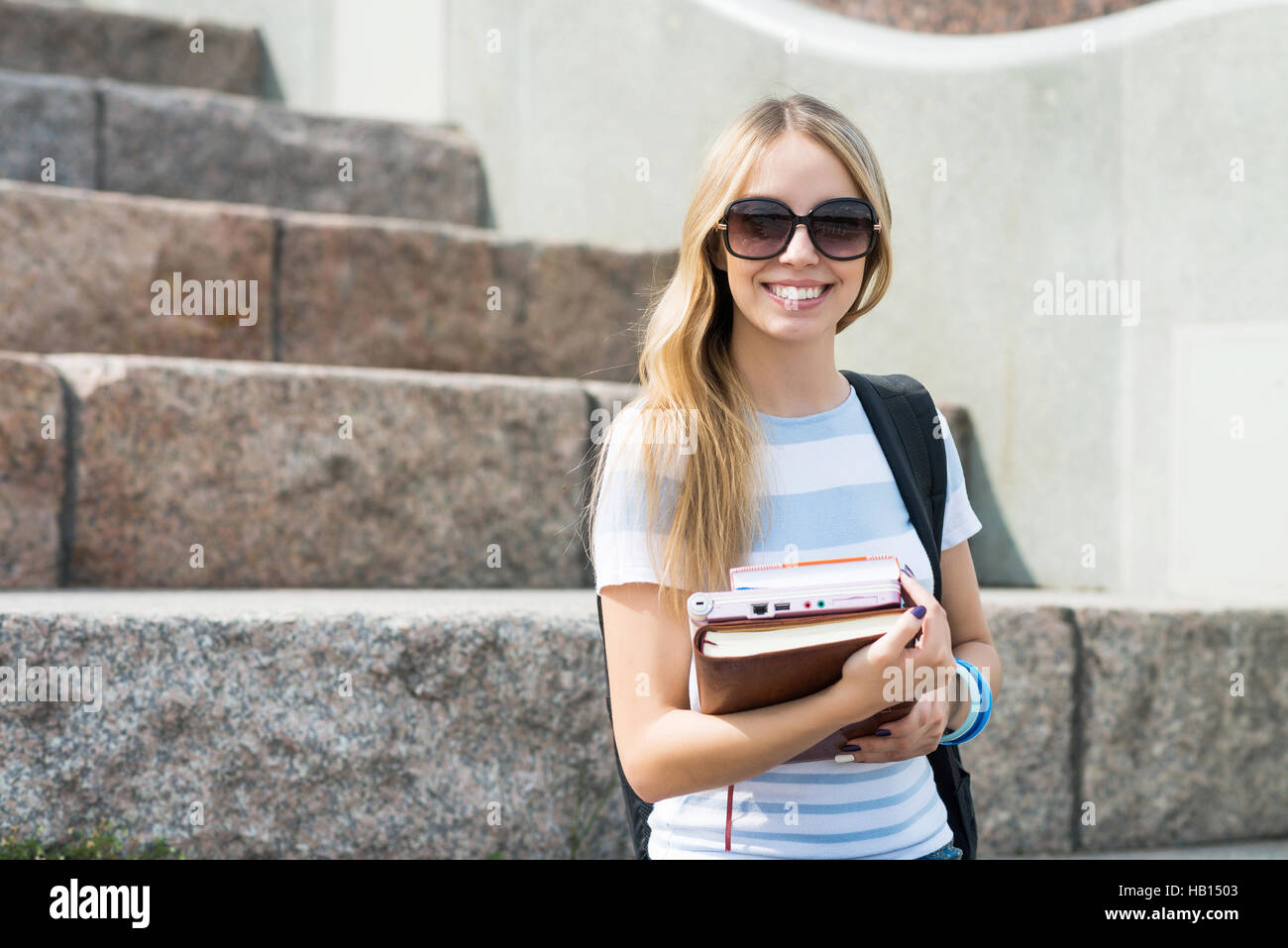 Student girl at staircase Stock Photo - Alamy