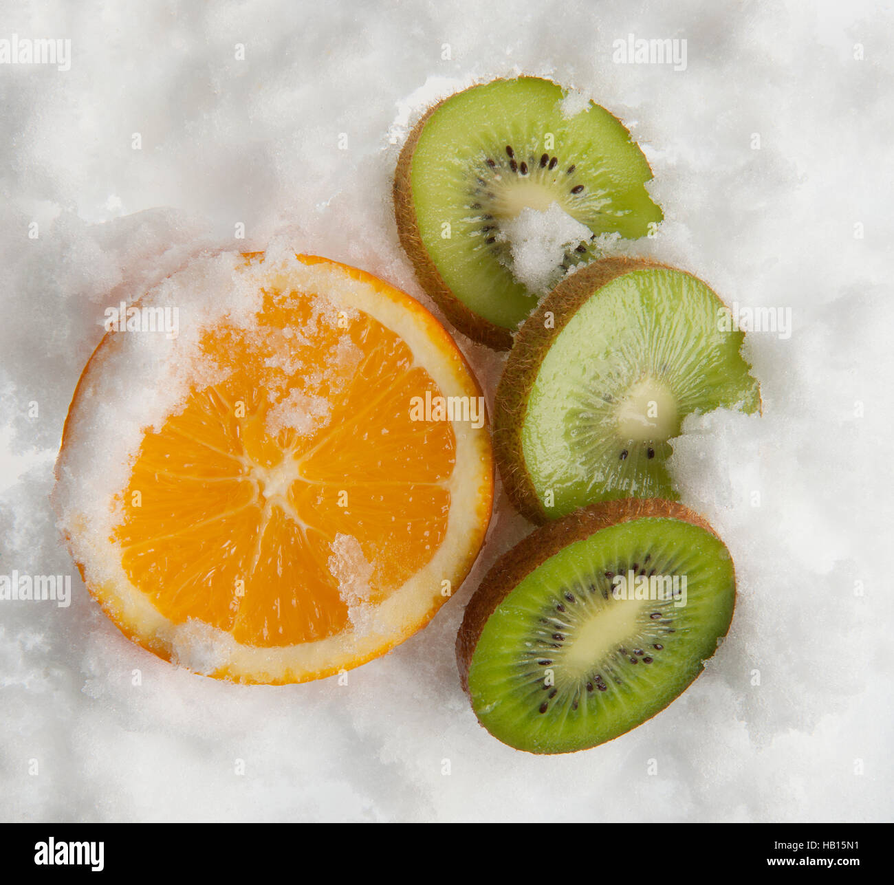 Tasty, frozen, colorful fruit on snow background Stock Photo - Alamy