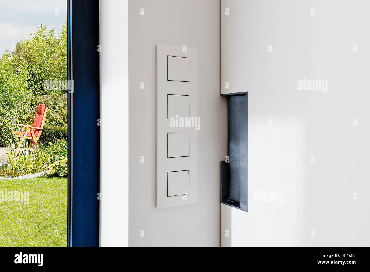 Light Switch near a sliding door in a modern apartment with view on a ...