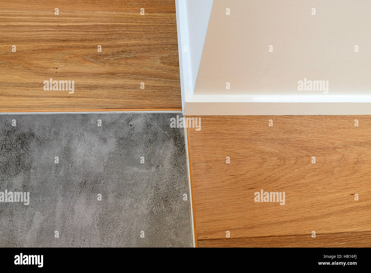 Close up on joints between wood, baseboards and stone floor Stock Photo ...