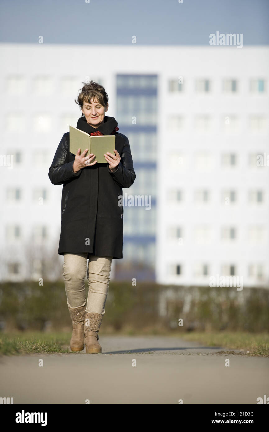 woman walk and reading near Stock Photo - Alamy