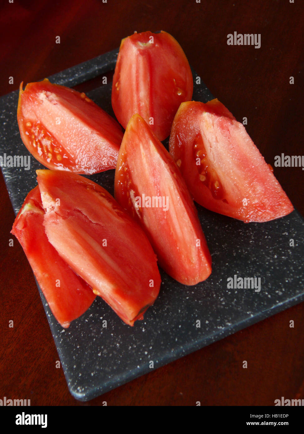 Red fresh tomato pieces Stock Photo - Alamy