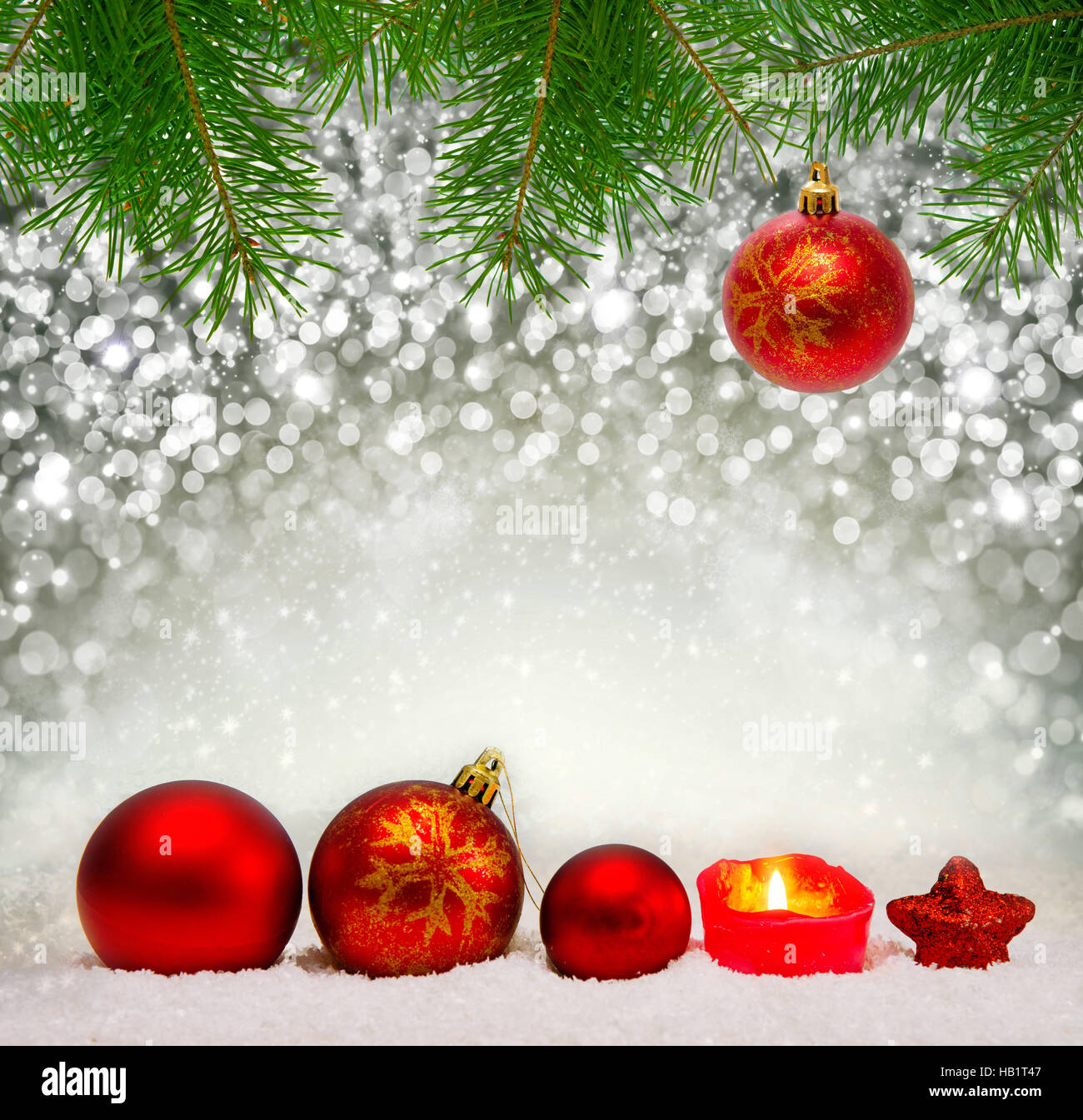 Red Christmas balls and Advent candle Stock Photo - Alamy
