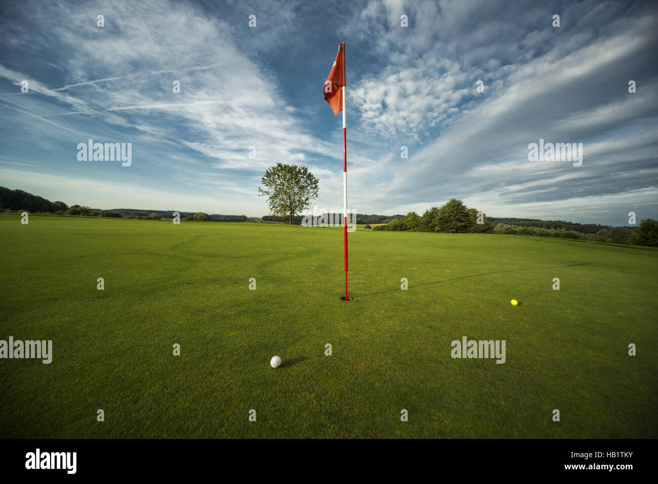 Golf court Green with Flag Stock Photo - Alamy