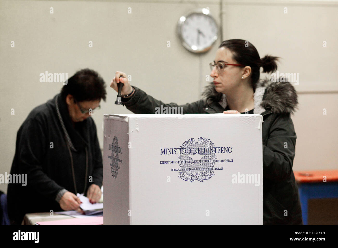 Rome, Italy. 03rd Dec, 2016. An official affixes labels to a voting ...