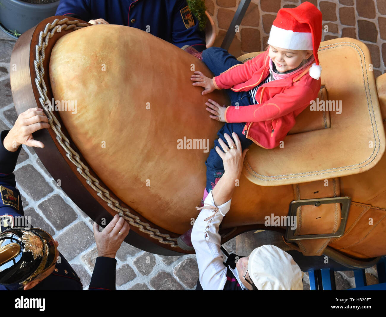 Leisnig, Germany. 02nd Dec, 2016. A small girl sits on the world's ...
