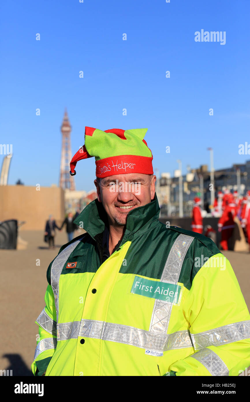 Blackpool, UK. 4th Dec, 2016. A first Aider wearing an Elf hat with the ...