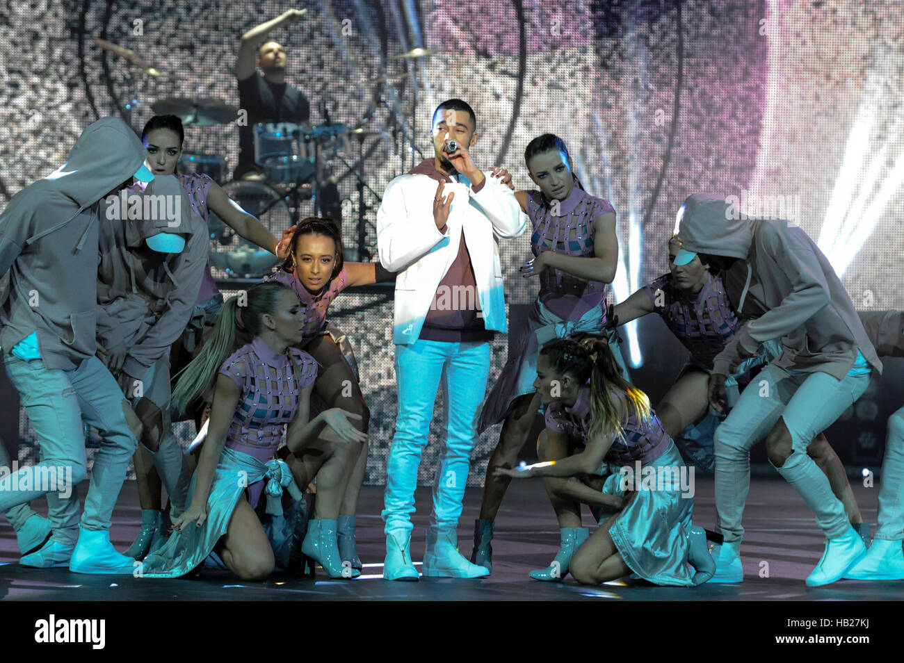 Singer Daecolm performs whilst surrounded by dancers during the Rock ...